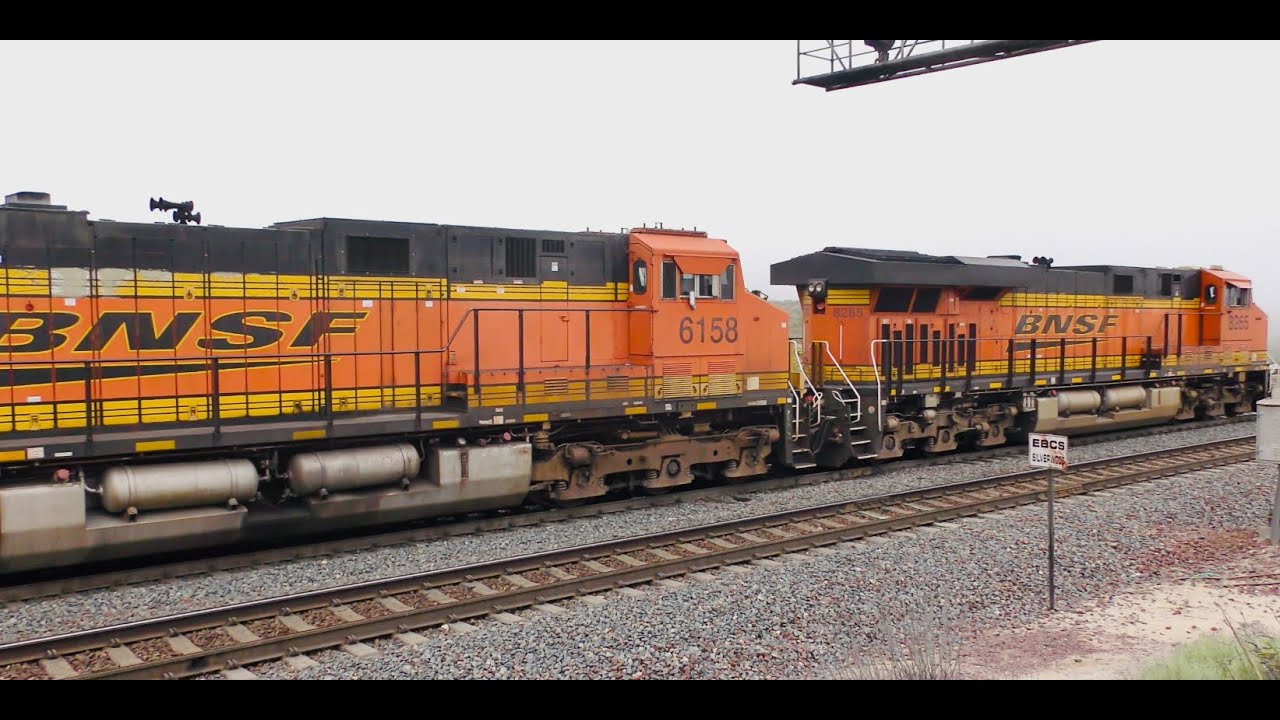 BNSF EB intermodal climbs through waves of coastal fog in upper reaches of Cajon Pass at ...