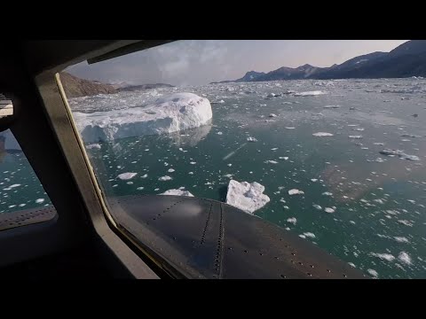 Scientists fly over Greenland to track melting ice