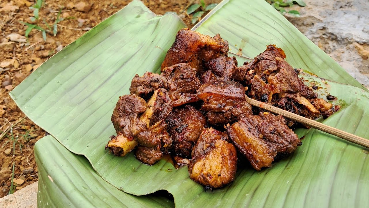 Piglet meat cooking in Lotha Naga style. Cooking little porky piggy ...