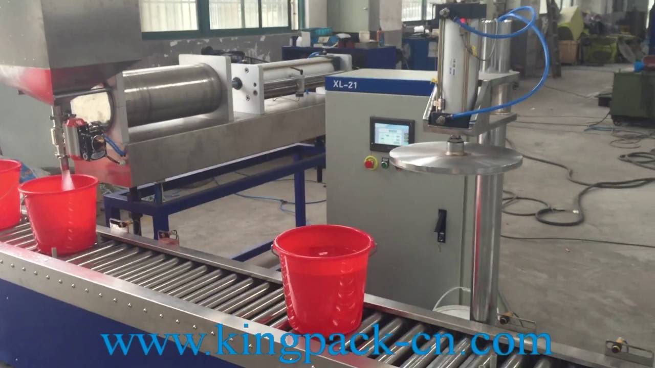 Automatic Weighing Type Bucket Filling Cappiing Machine - YouTube