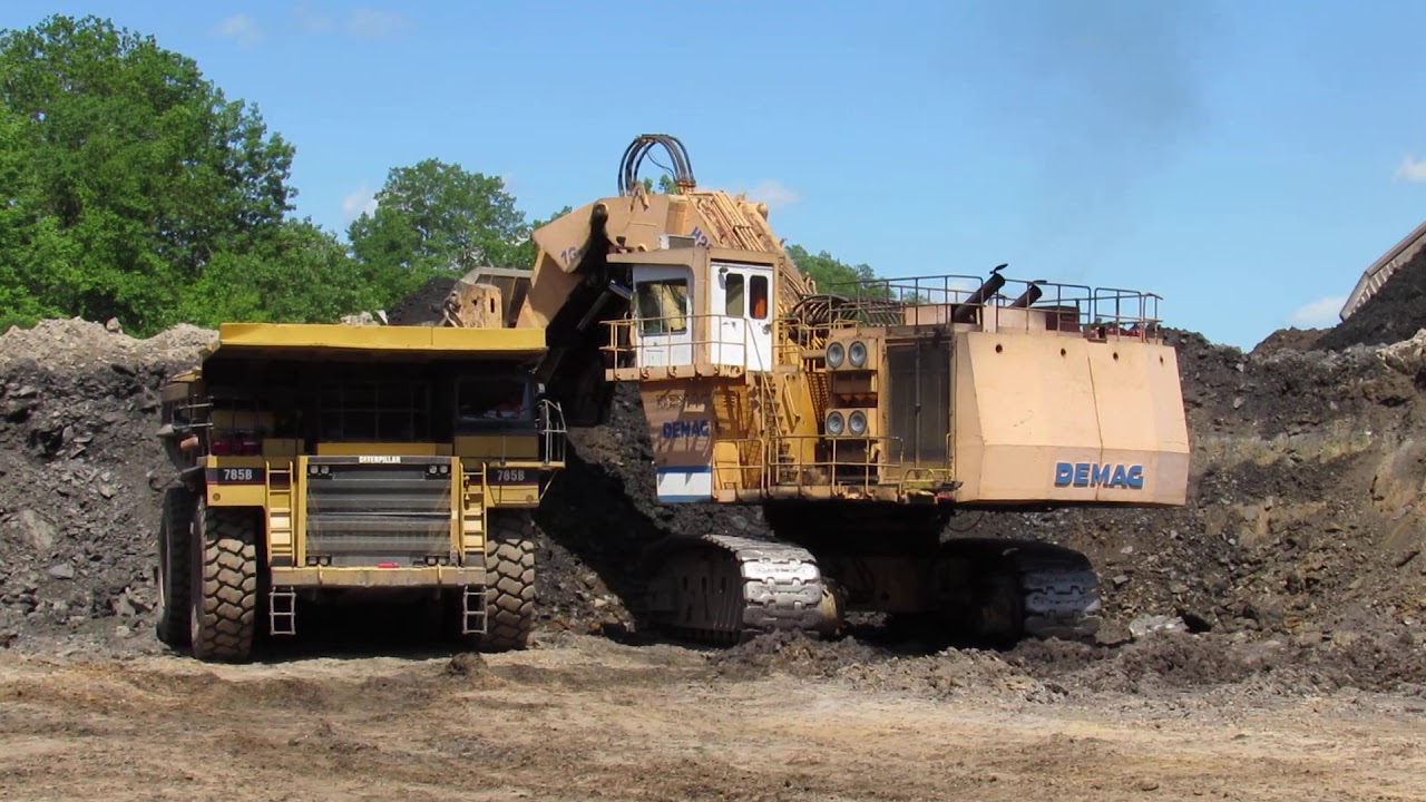 Demag H285 loading Cat 785s - YouTube