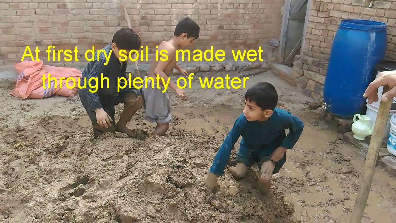 Preparing mud at home for covering roof - YouTube