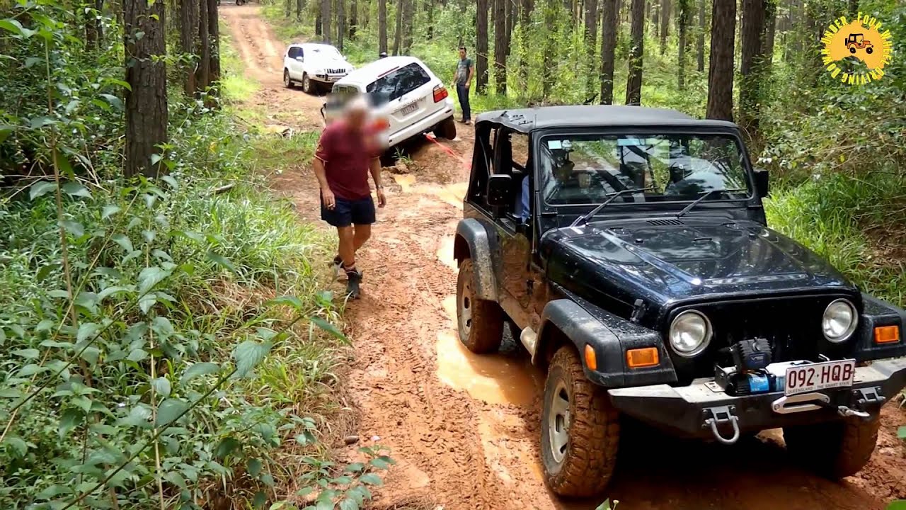 4x4 (4WD) Action - Landcruiser stuck in mud and Jeep Wrangler pulls it ...