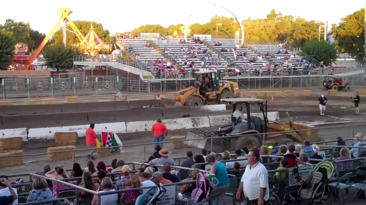 Stanislaus County Fair Lawn Mower Racer into Mud Bog Track - YouTube