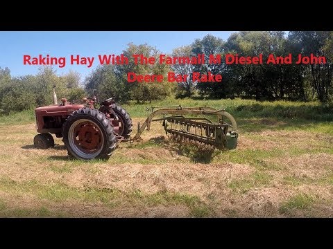 Raking Hay With The Farmall M Diesel And John Deere Bar Rake - YouTube