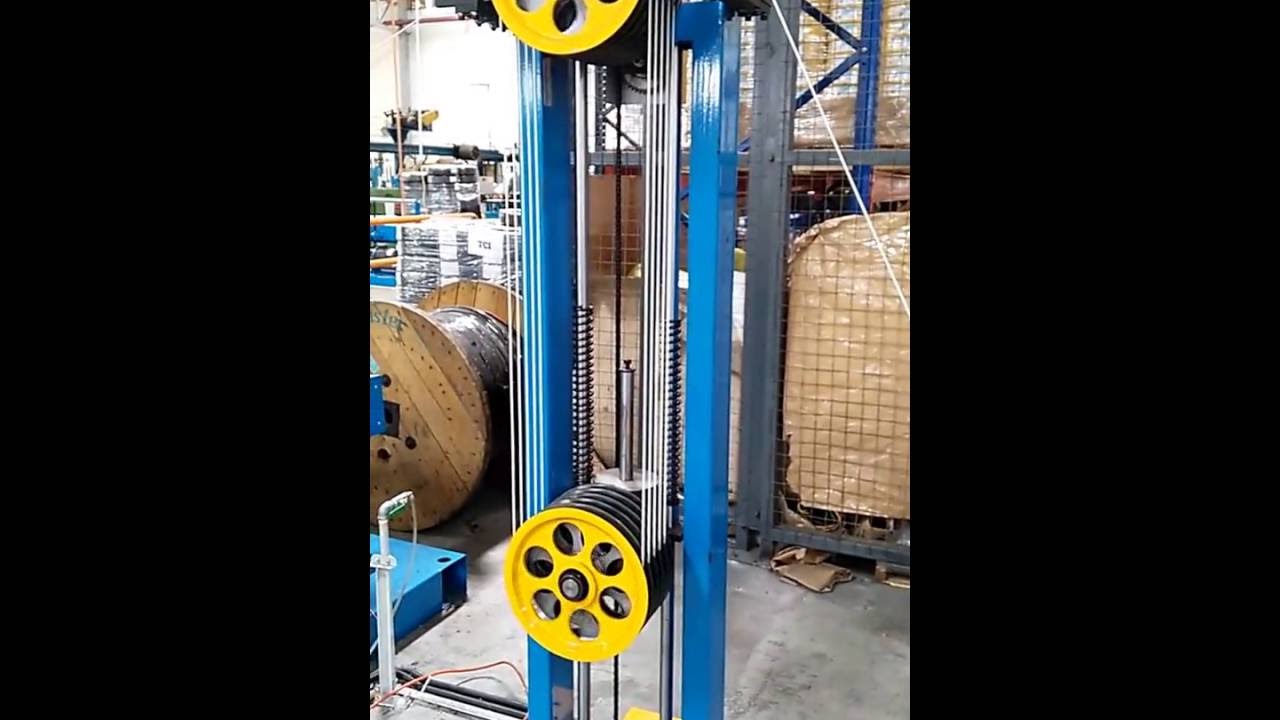 wire and cable coiling machine - YouTube