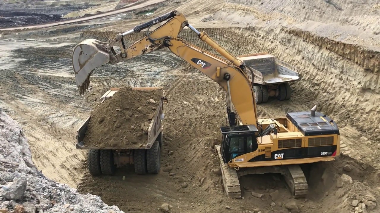 Caterpillar 385C Excavator Loading Caterpillar Dumpers - Interkat SA ...