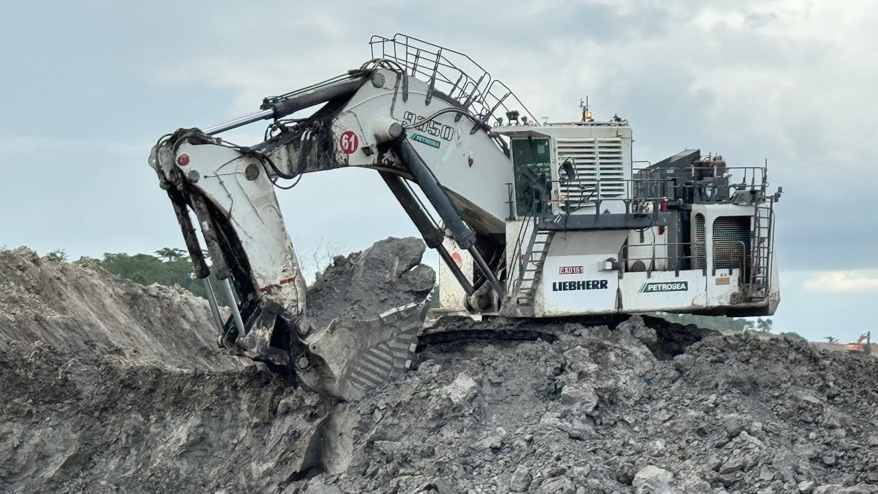 Big digger liebherr R9350 Excavator loading komatsu & caterpillar truck ...