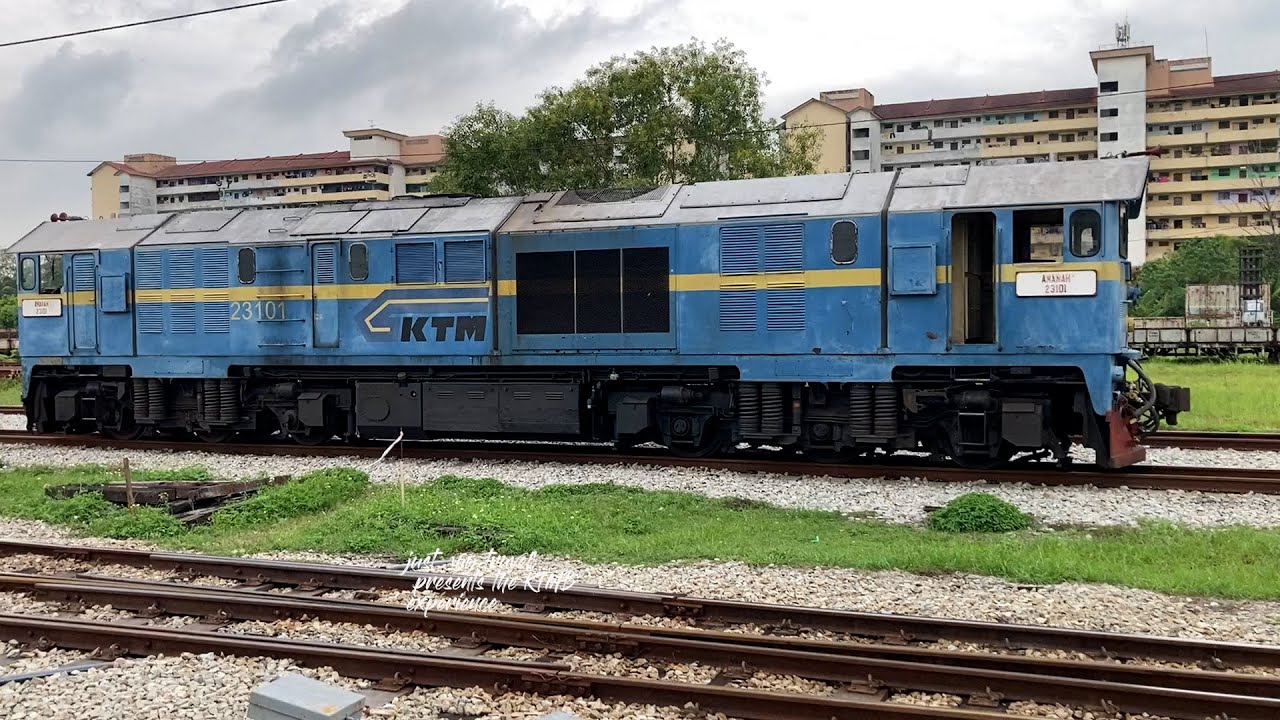 KTMB Class 23101 Amanah loco with flatbed wagons from North Port. The ...