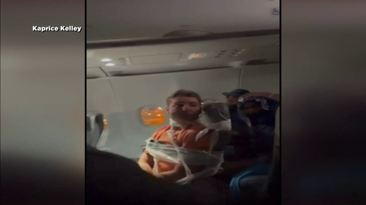New video shows different angle of man taped to seat after outburst on ...