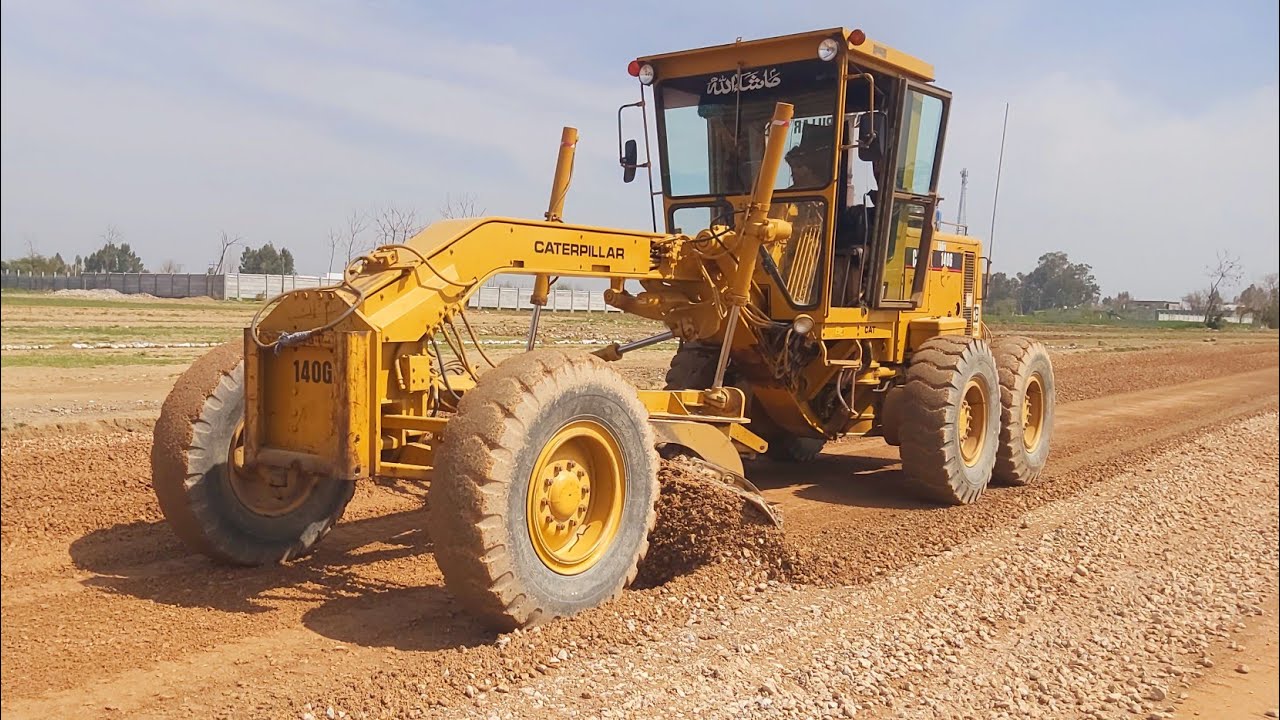 moter grader operater mixing aggregate base course road construction ...