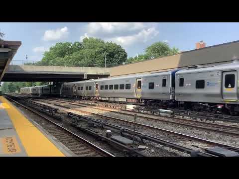 Red train & blue train is stopping at Williams Bridge Station in Metro ...