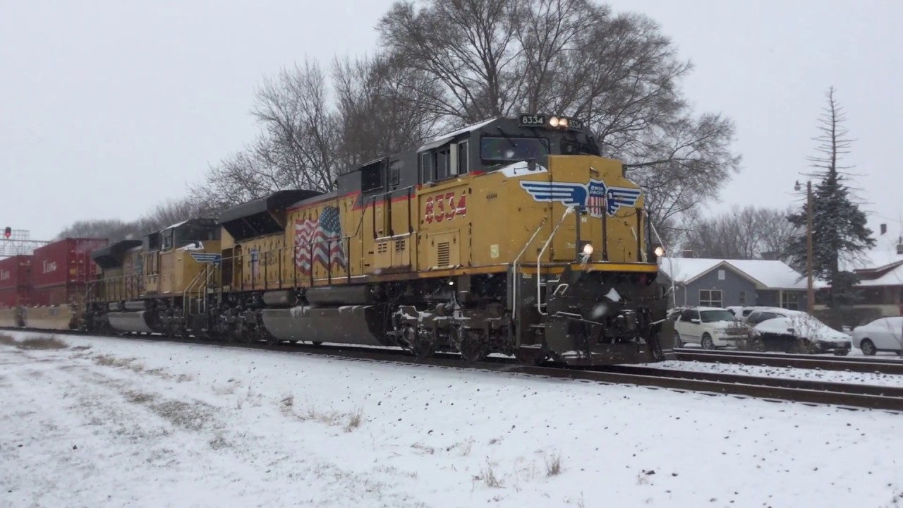 UP 8334 (SD70ACe) leads a Eastbound Union Pacific stack train through Rochelle, IL 12/24/17 ...
