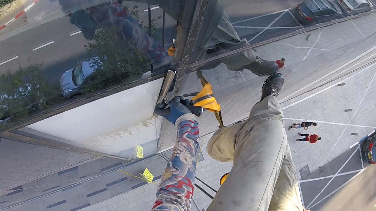 rope access window cleaning - moving horizontally with 2 vacuums - YouTube