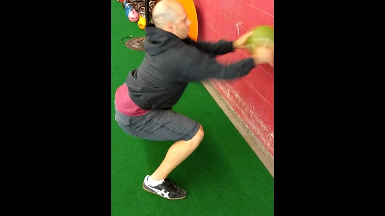 Med ball push pass in a half squat position - YouTube