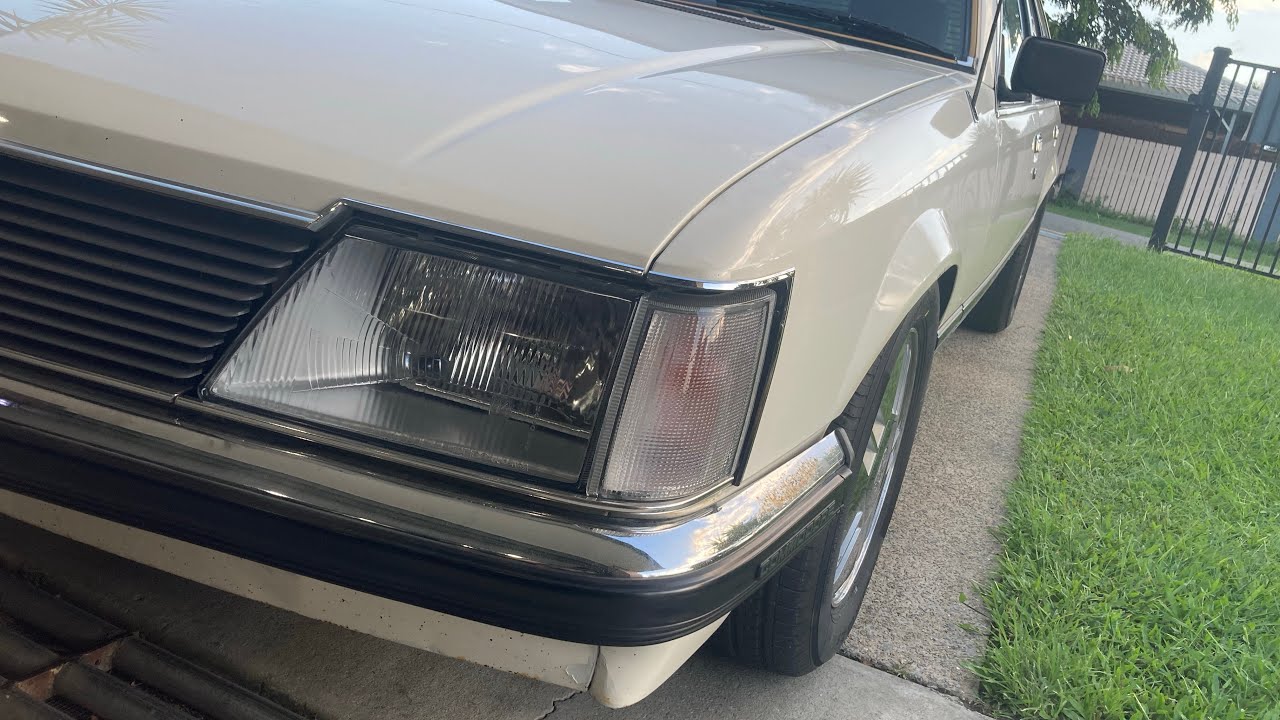 Early (VH) commodore gas bonnet strut install. - YouTube