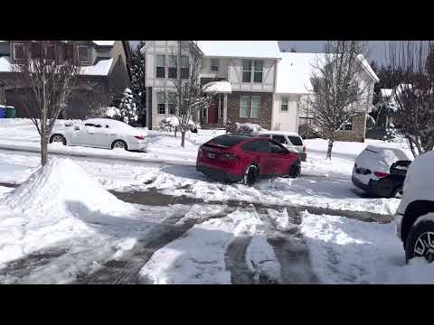 Tesla model X driving in snow