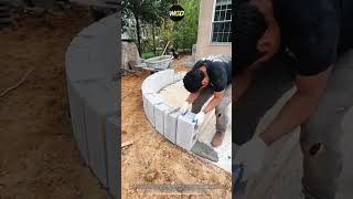 Build perfect curved cinder block retaining walls using a wooden radius guide