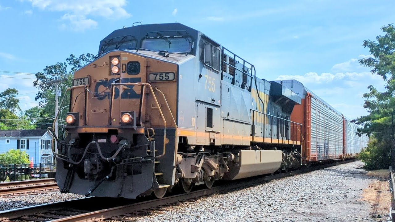 Northbound CSX autorack with mid-train DPU on track one - YouTube