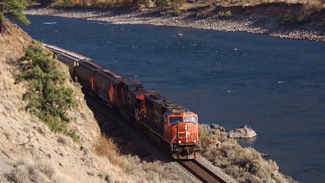 EMD SD75i Following The Thompson River Pulling Loaded Grain Hoppers ...