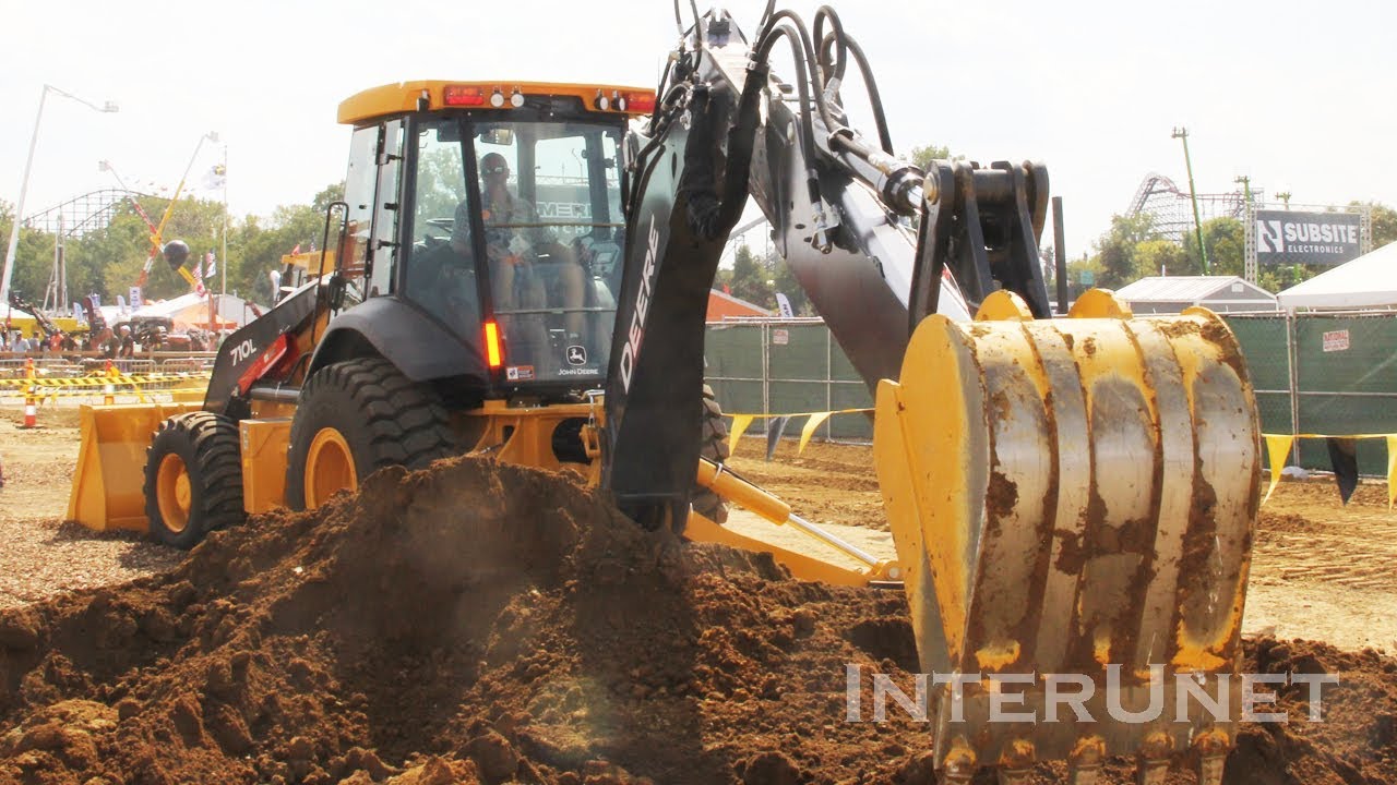 Backhoe Digging Deere 710L with Hydraulic Bucket on a Boom - YouTube