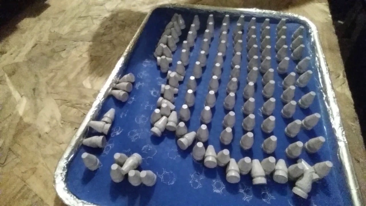 Powder coating 9-millimeter bullets on silicone mat - YouTube