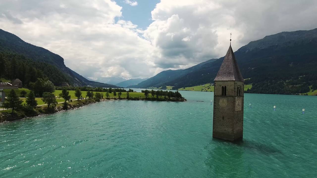 Church Tower in the Resia lake • Tourist Attraction Mals