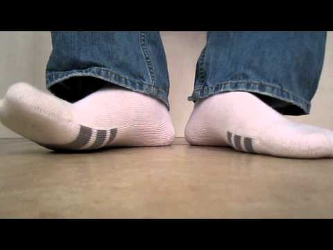 White and gray Adidas no show socks.