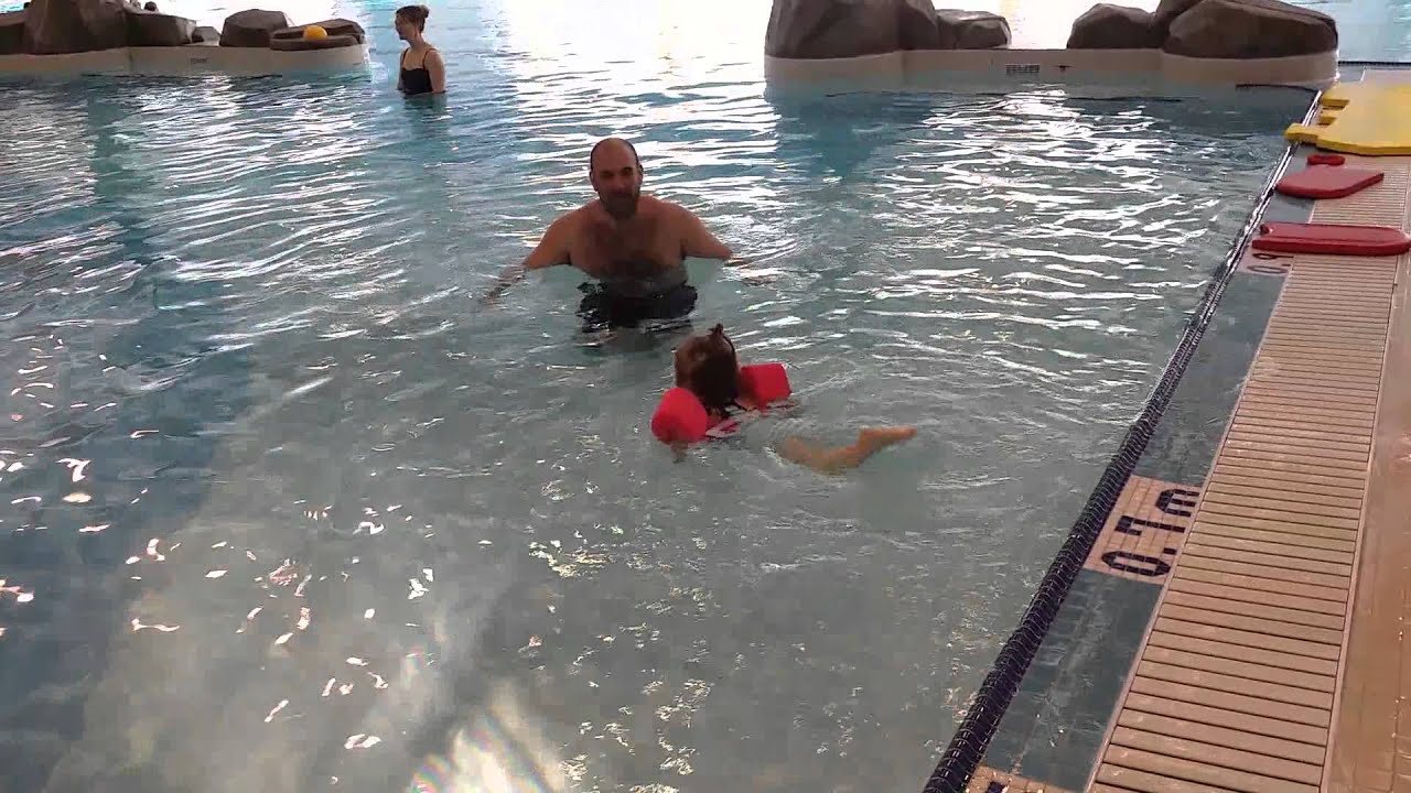 Swimming with her puddle jumper on - YouTube