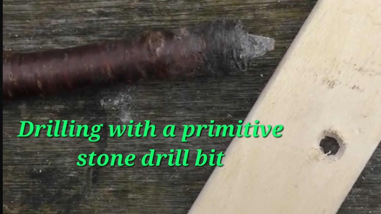 Drilling wood with a primitive flint drill bit - YouTube