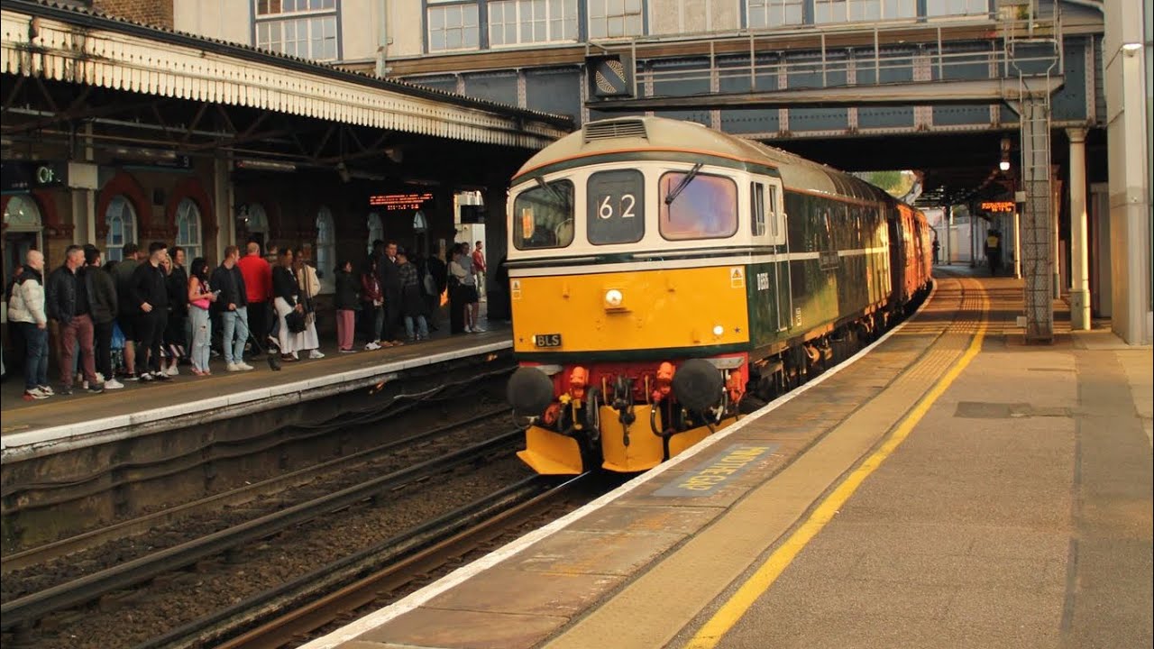 33012 and 438828 (with 73136 on the rear)visit Clapham Junction from ...