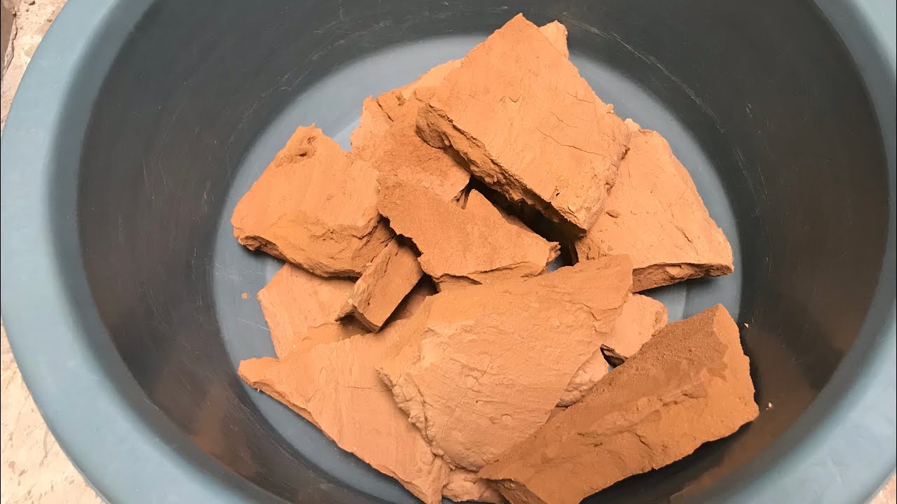 Damp very hard orange mud crumbling into pieces - YouTube