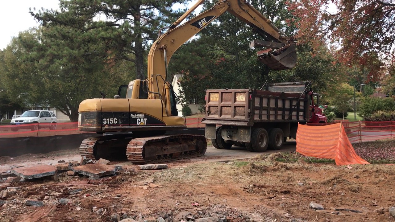 Driveway demolition with Cat 315 excavator - YouTube