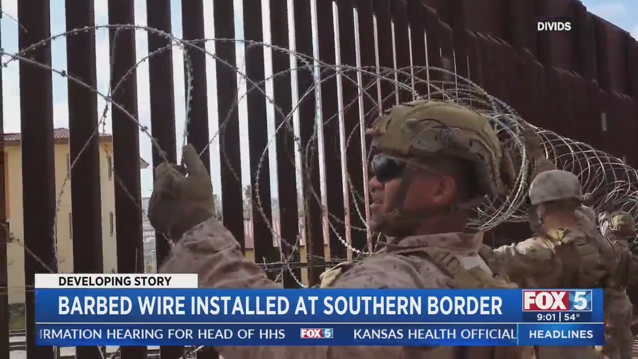 Barbed wire installed at southern border - YouTube