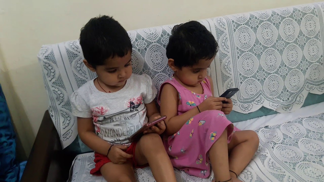 Cute Vani-Vini busy on mobile for cartoon videos - YouTube