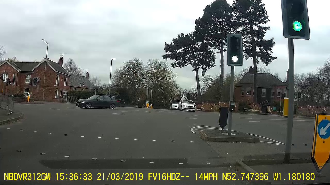 Crossing the path of oncoming traffic at a traffic light controlled ...