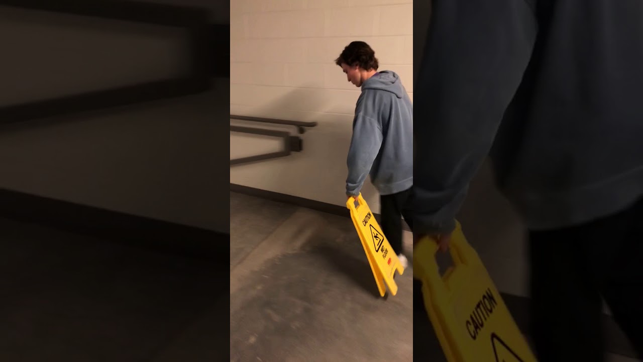 Guy slides down stairs on wet floor sign and falls. - YouTube