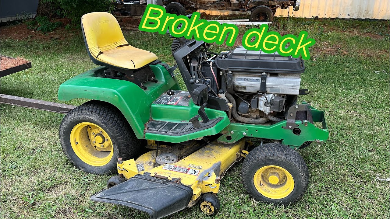 Welding a spindle back into a rusty John Deere mowing deck - YouTube