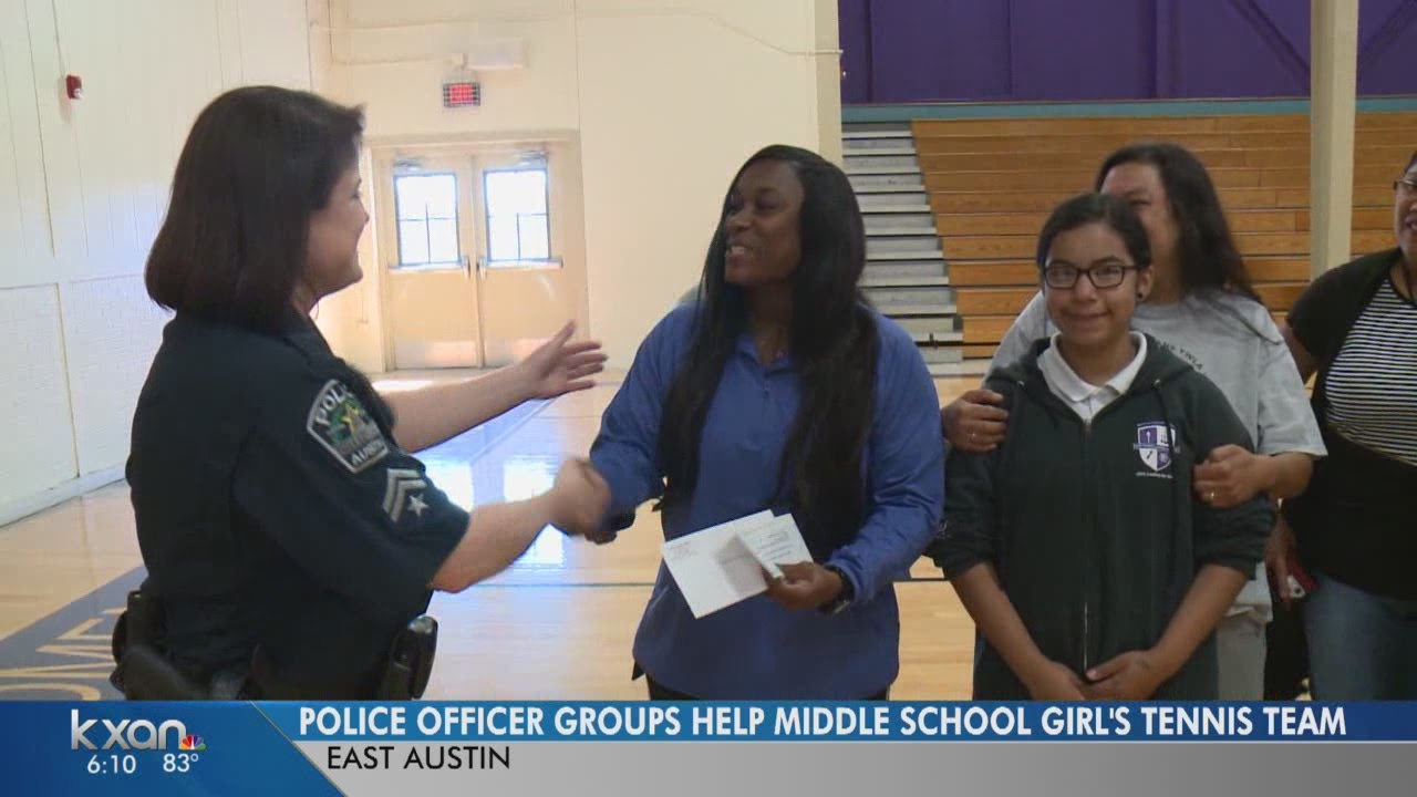 Austin police officers helping middle school students bring their A ...