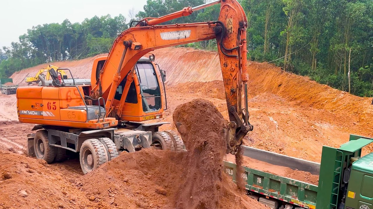 System Wheel Loader Loading Soil On Truck on Construction Site - JCB ...