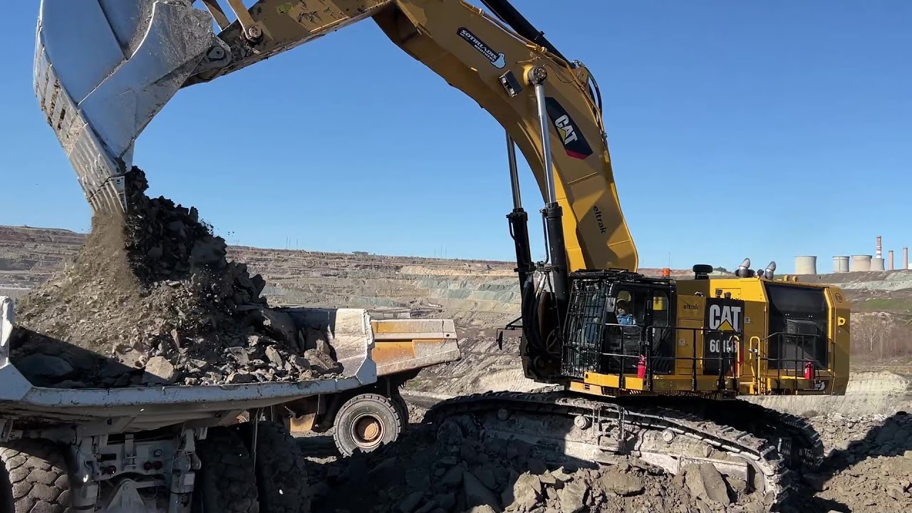 Caterpillar 6015B Excavator Loading Caterpillar 777D Dumpers ...