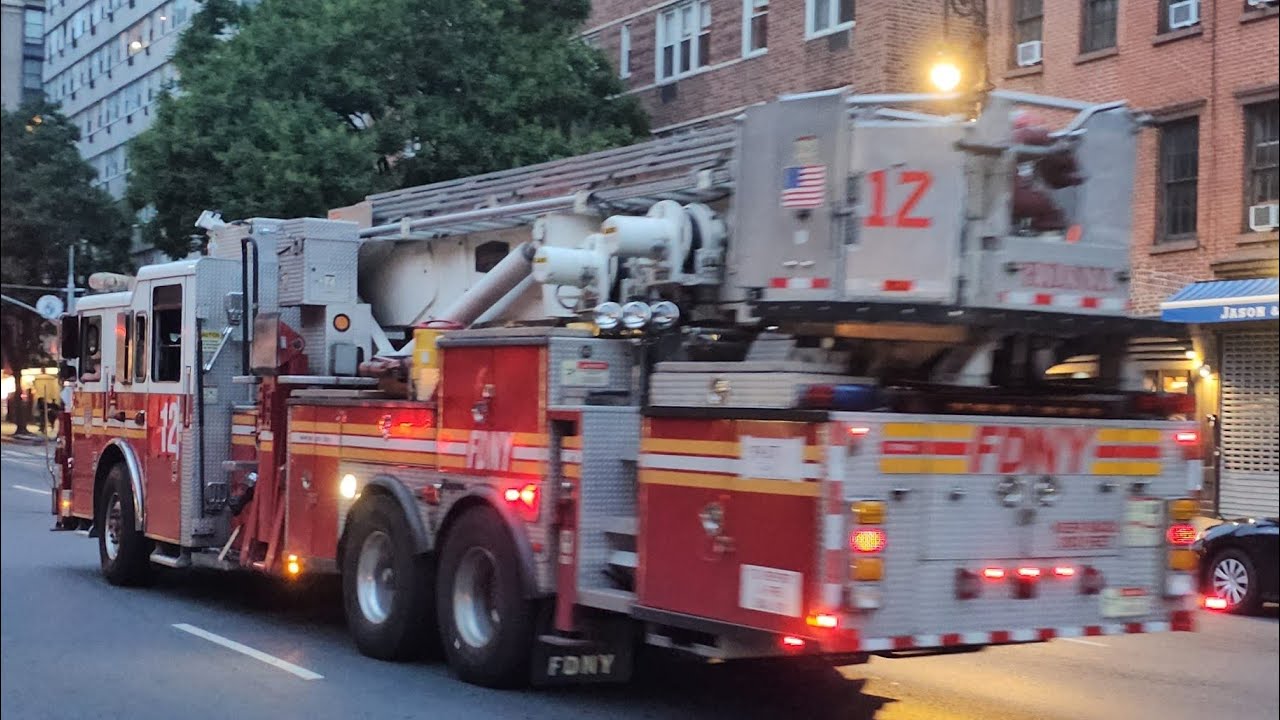 FDNY Ladder 12 Passing By On 6th Ave In Flatiorn District, Manhattan ...