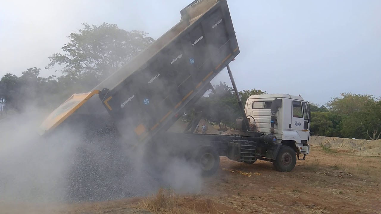 Coarse aggregate unloading from trucks 7 unit and measurements - YouTube