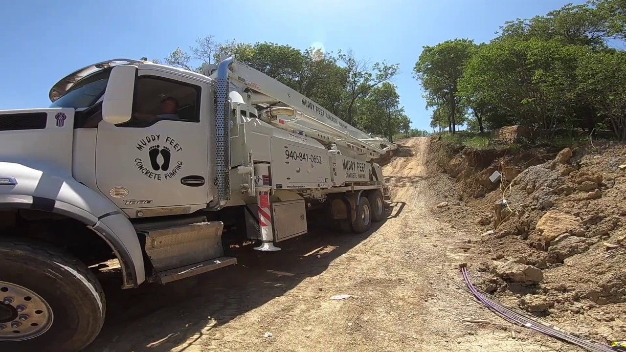 Pumping a house slab off the side of a hill with 2 boom pumps. Pumping ...