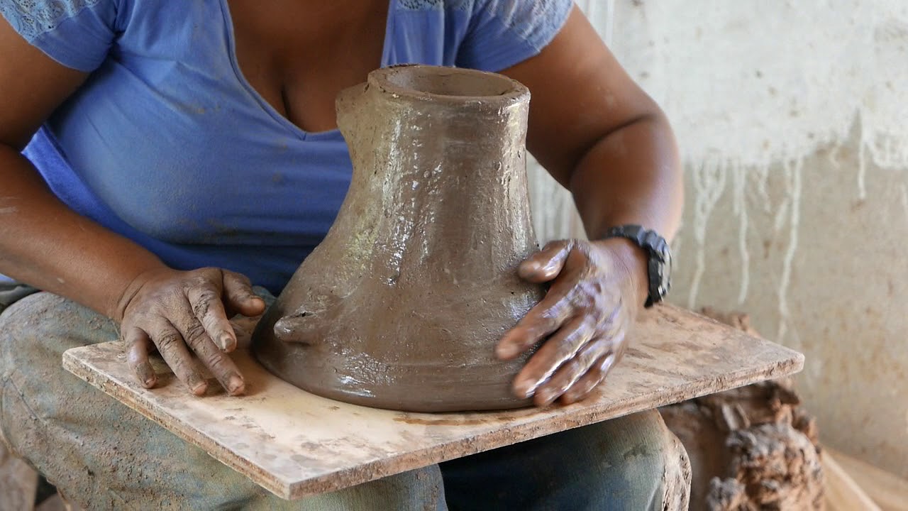 Doing the finishing work on a coal pot - YouTube