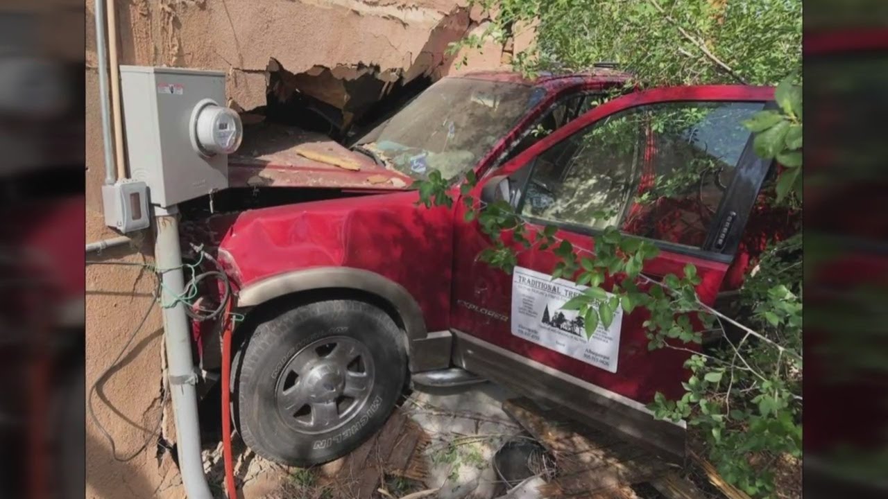 Car crashes through family's garage, driver flees - YouTube