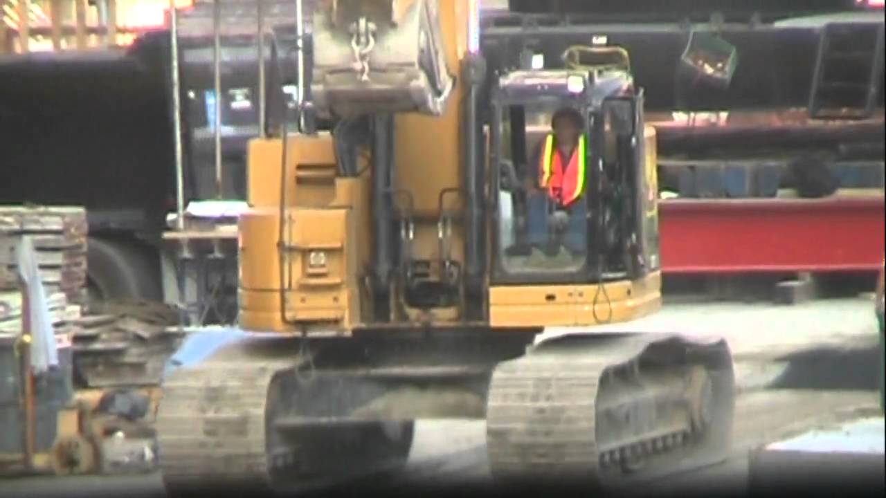 Cat 328D working - YouTube