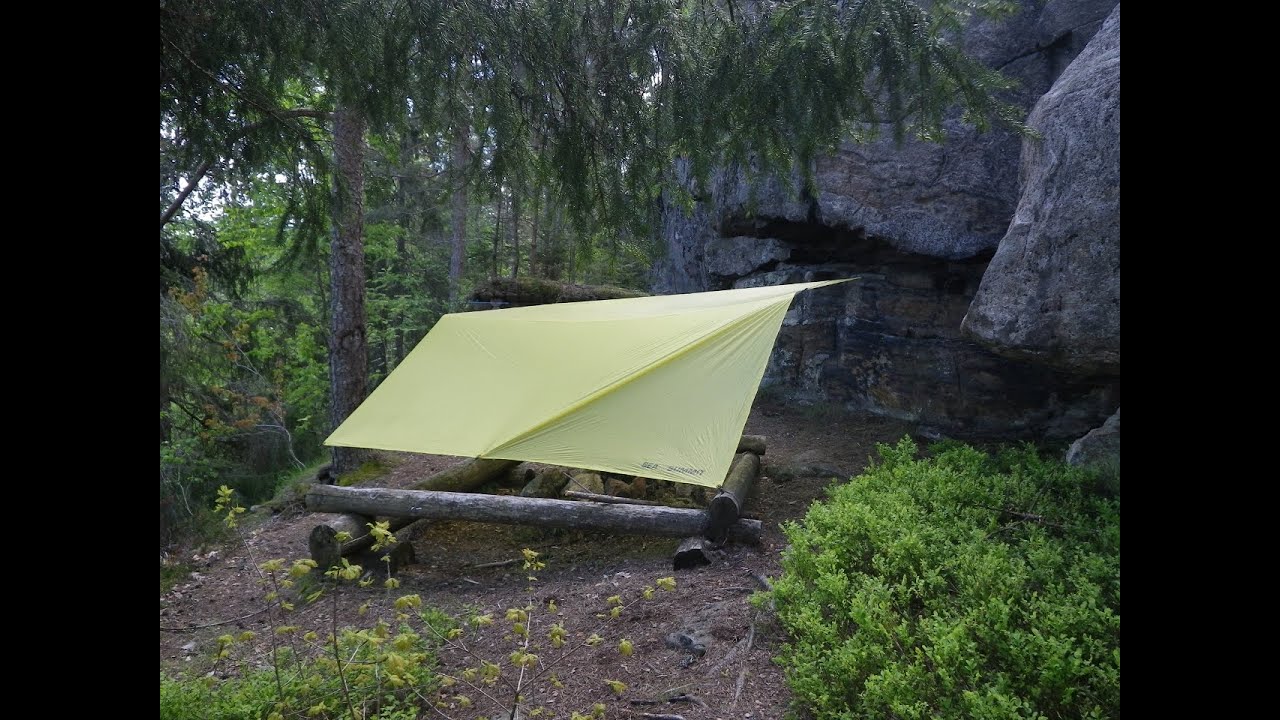 Tarp setup between a stone wall and one tree - YouTube