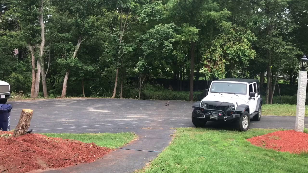 Jeep wrangler pulling tree stump - YouTube