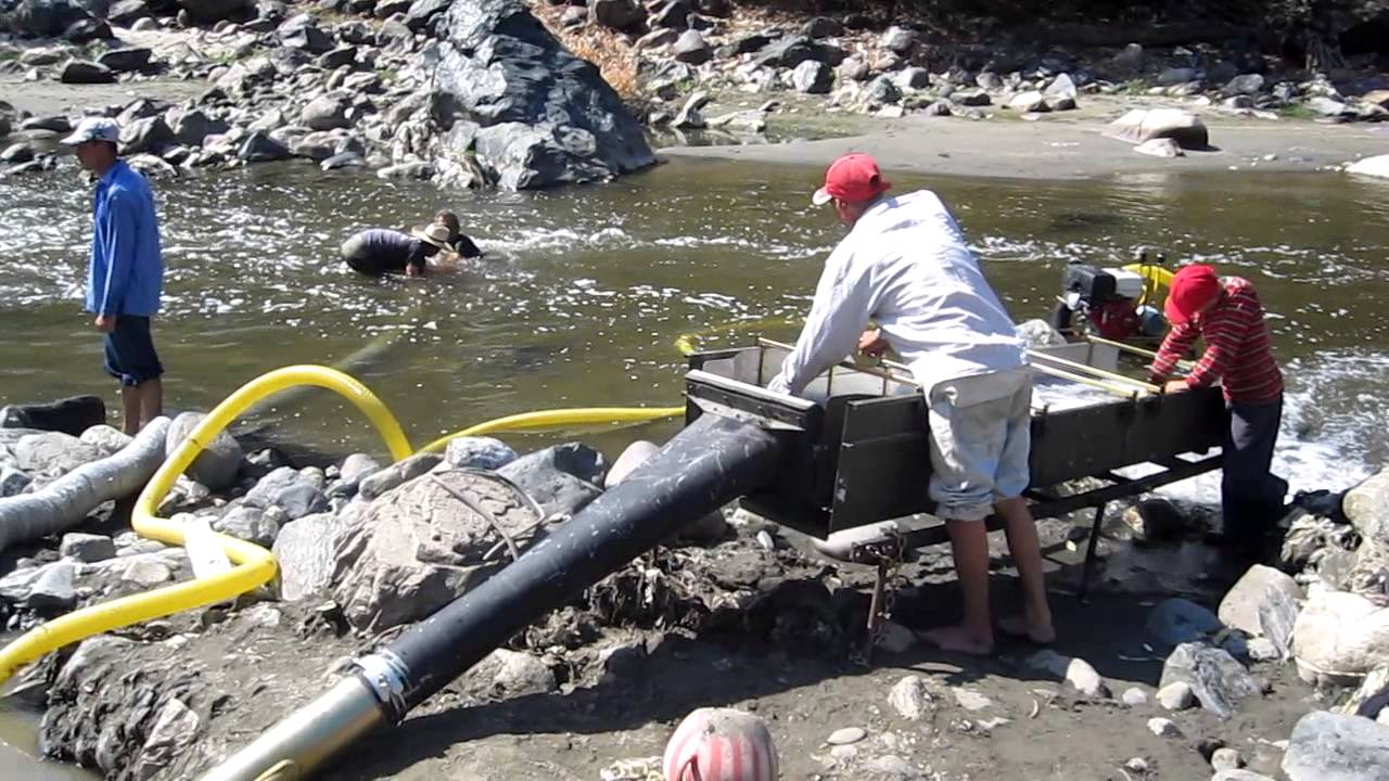 Sluice Box of the Dredge working using hoses and power engines - YouTube